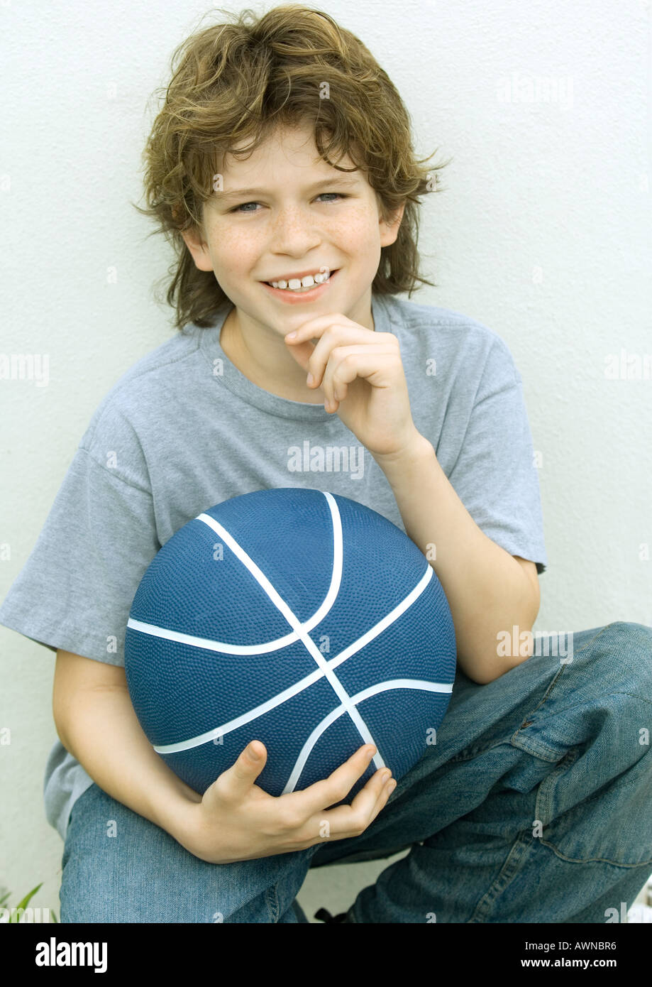 Boy holding basketball, portrait Stock Photo - Alamy