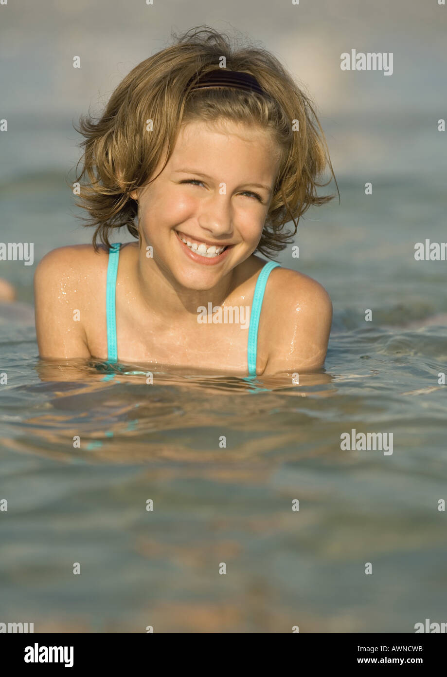 Girl in ocean, smiling Stock Photo - Alamy
