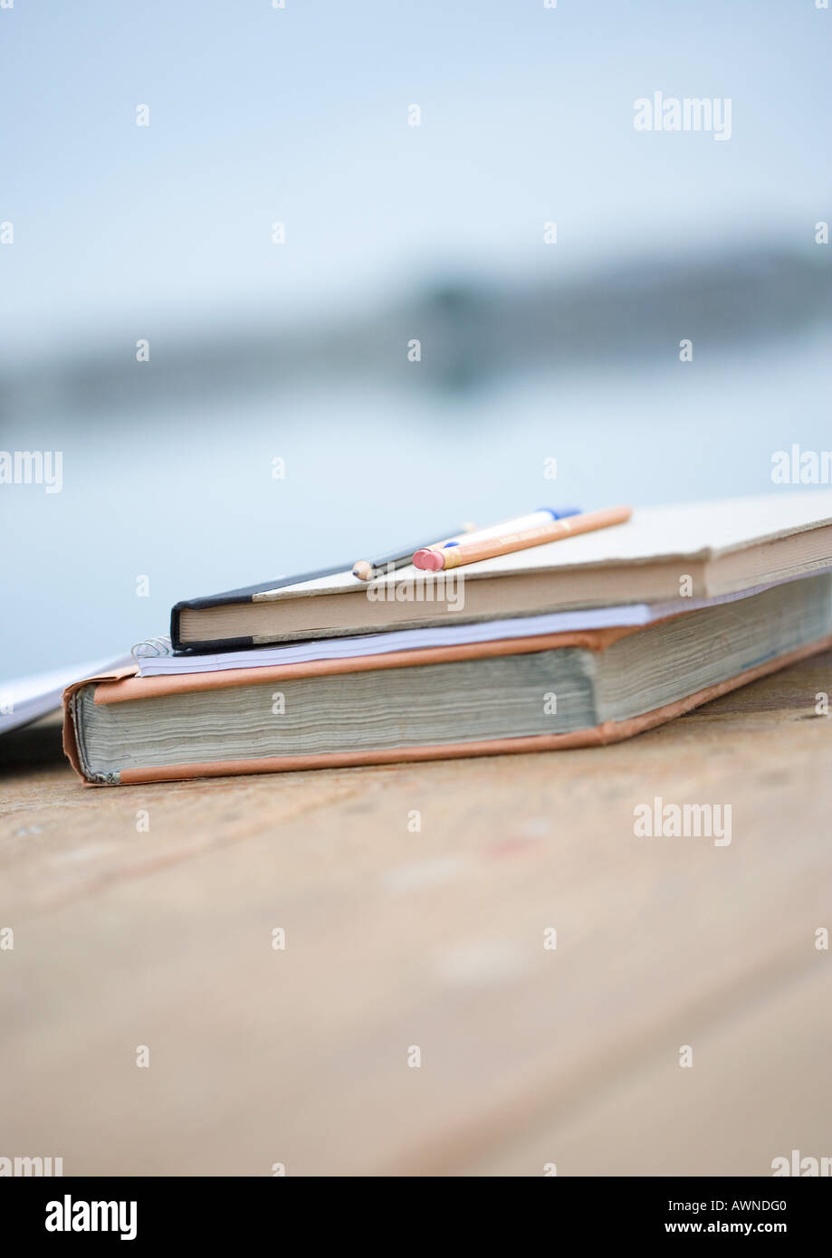 Books piled outside hi-res stock photography and images - Alamy