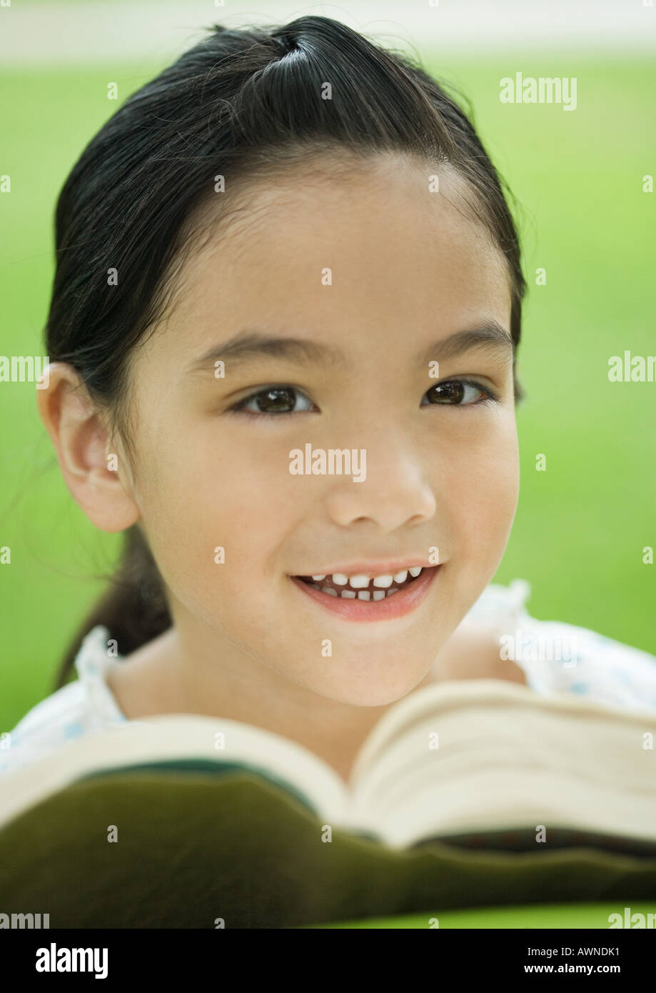 Girl with book, portrait Stock Photo - Alamy