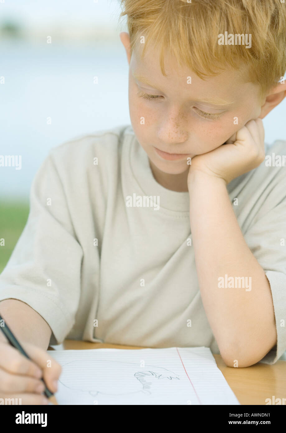 Boy doing homework Stock Photo - Alamy