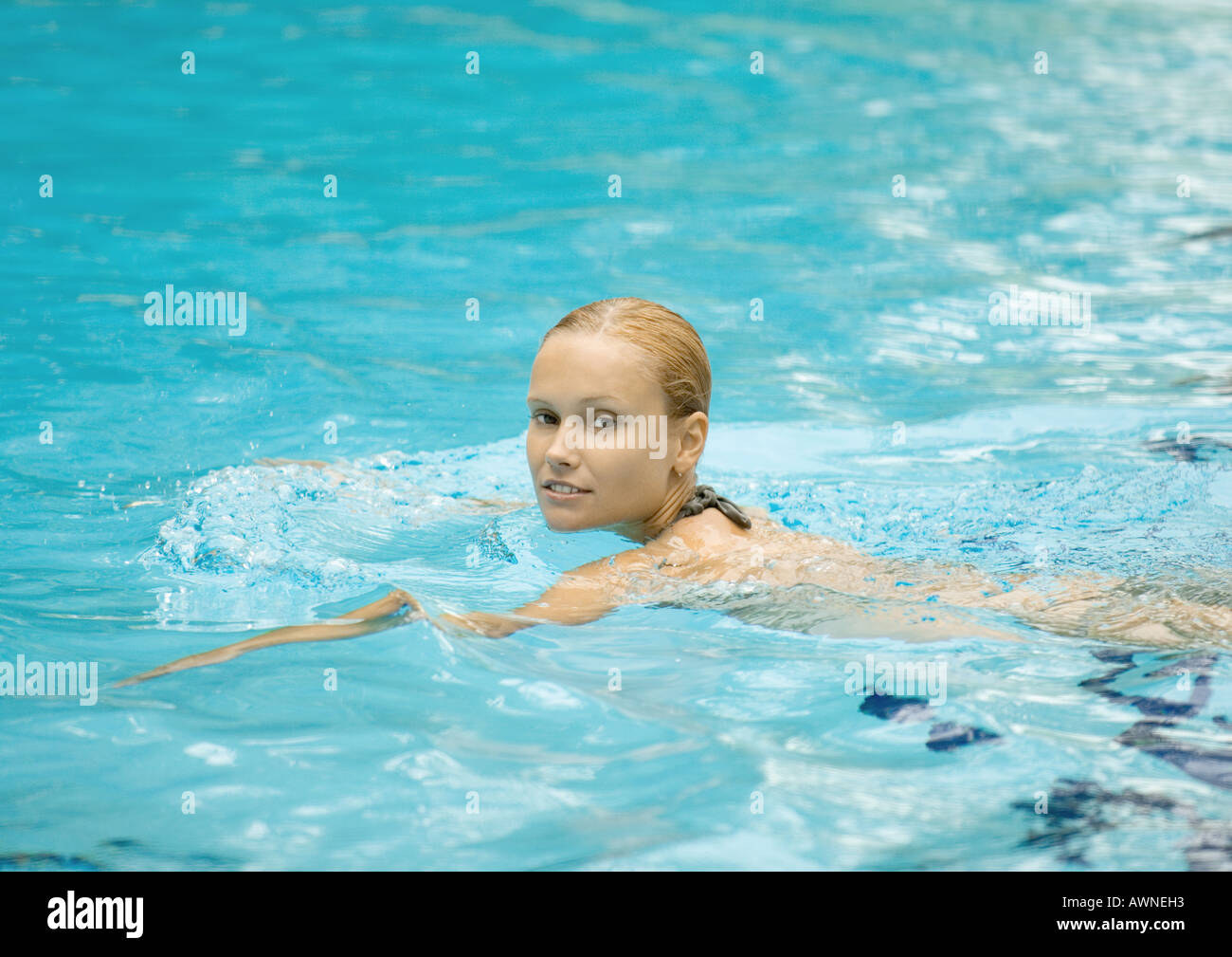 Young woman swimming in pool Stock Photo - Alamy