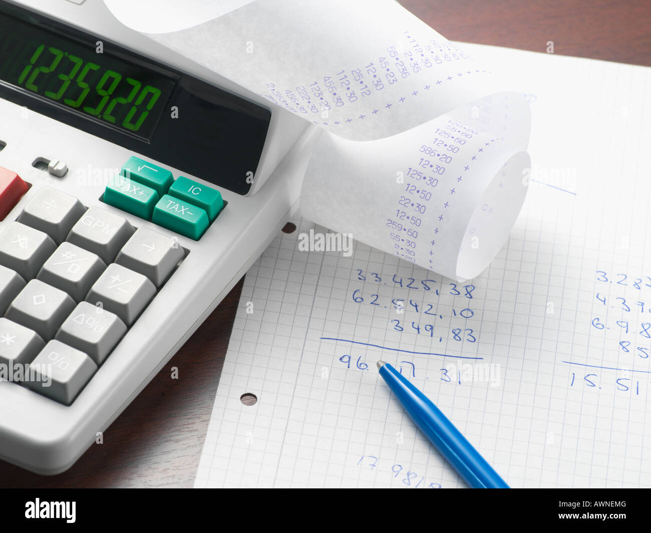 A calculator and sums on paper Stock Photo - Alamy