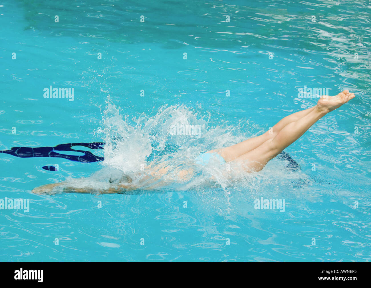 Woman diving into pool Stock Photo - Alamy
