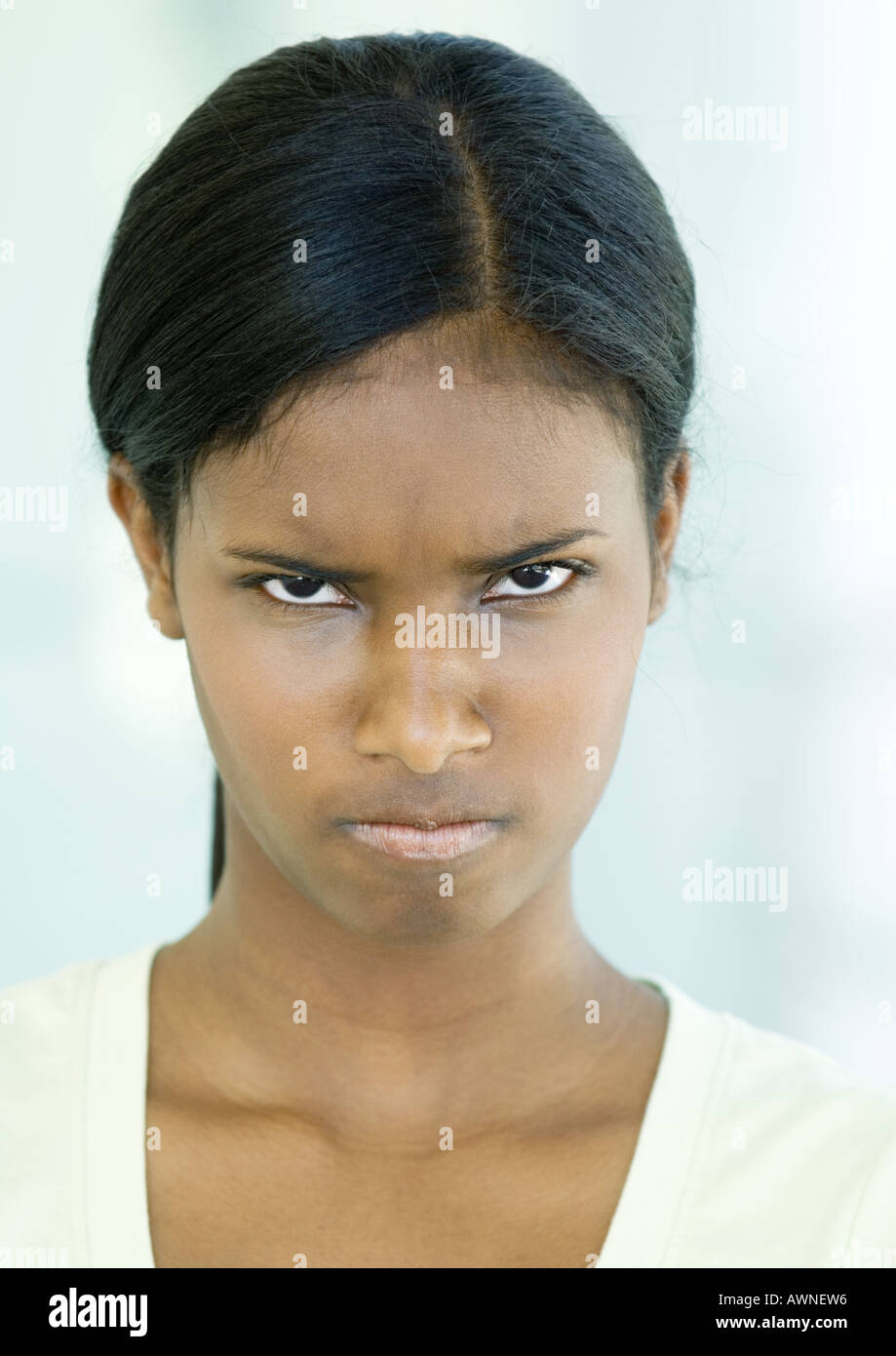 Teen girl frowning, portrait Stock Photo - Alamy