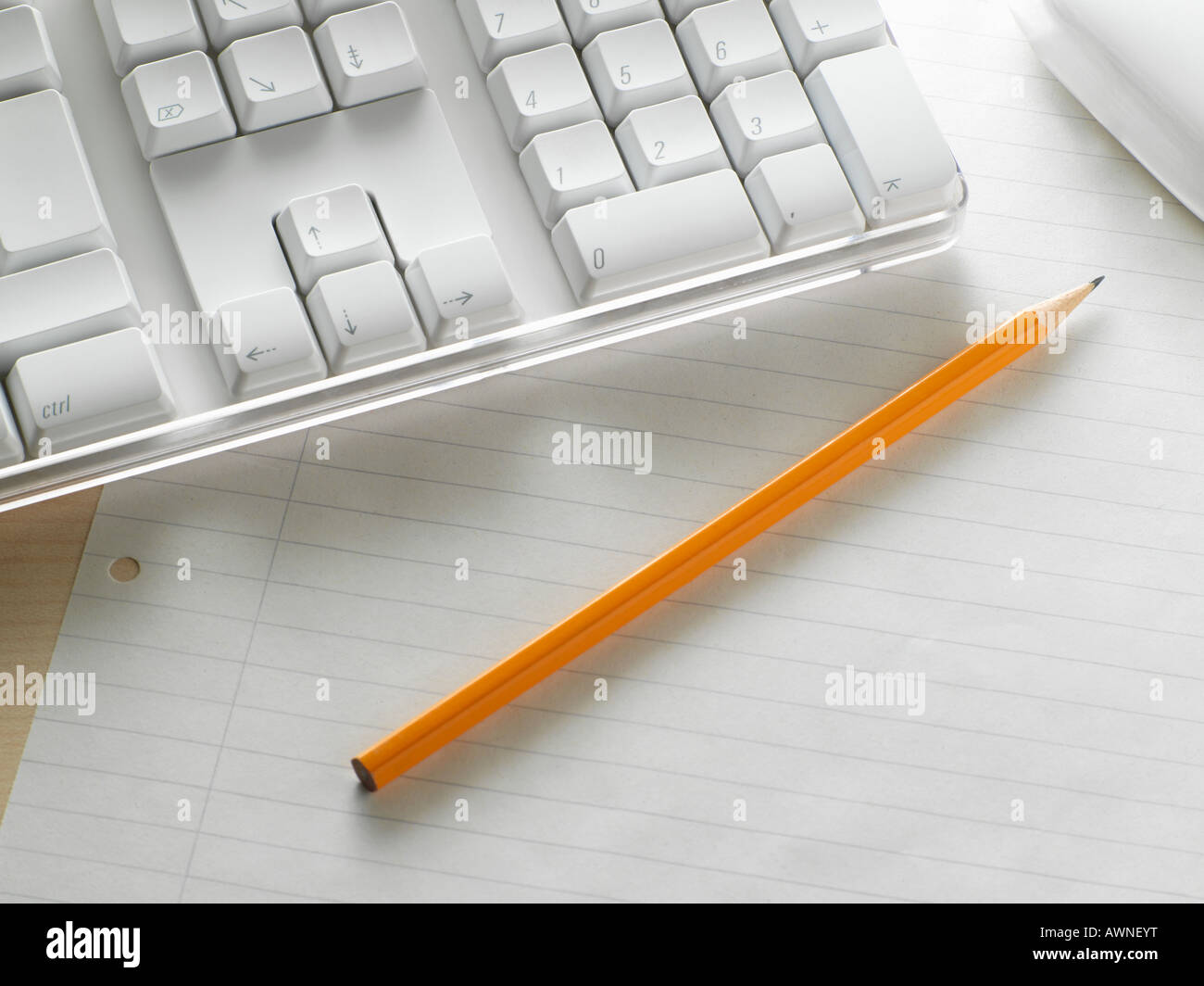 A pencil paper and a computer keyboard Stock Photo - Alamy