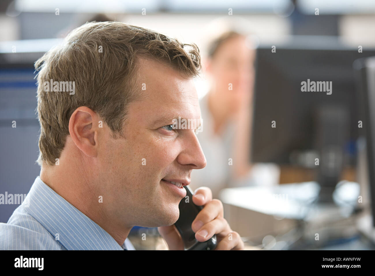 Businessman using a telephone Stock Photo - Alamy