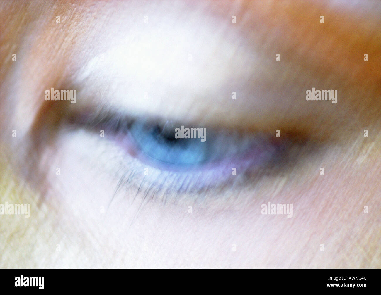 Woman's blue eye looking down, blurred close up Stock Photo - Alamy