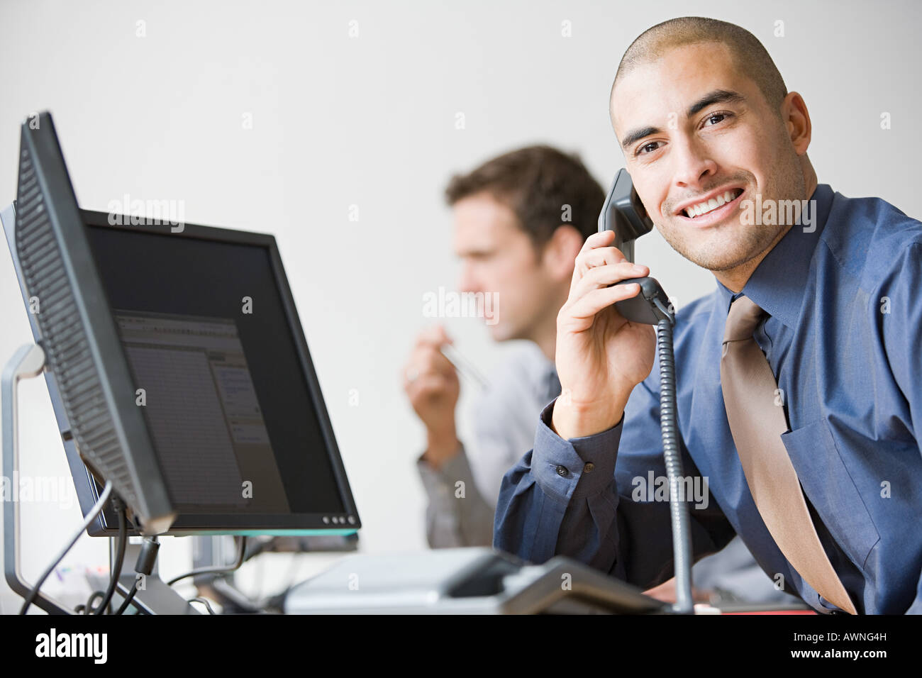 Businessman using a telephone Stock Photo - Alamy