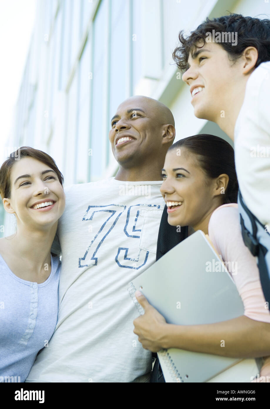 Group of college students standing close together, smiling Stock Photo ...