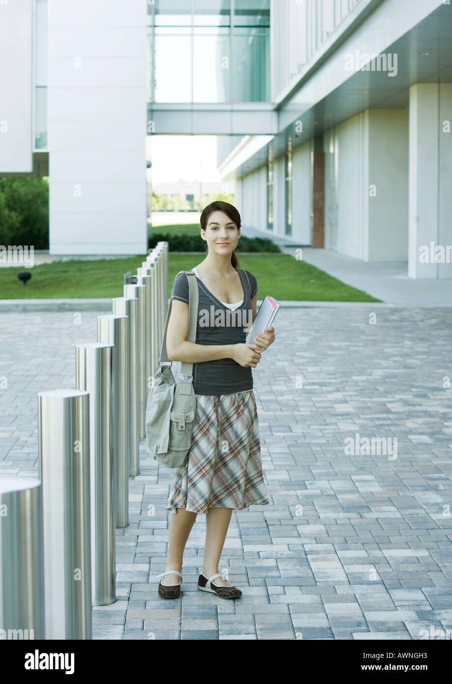 Female college student standing on campus Stock Photo - Alamy