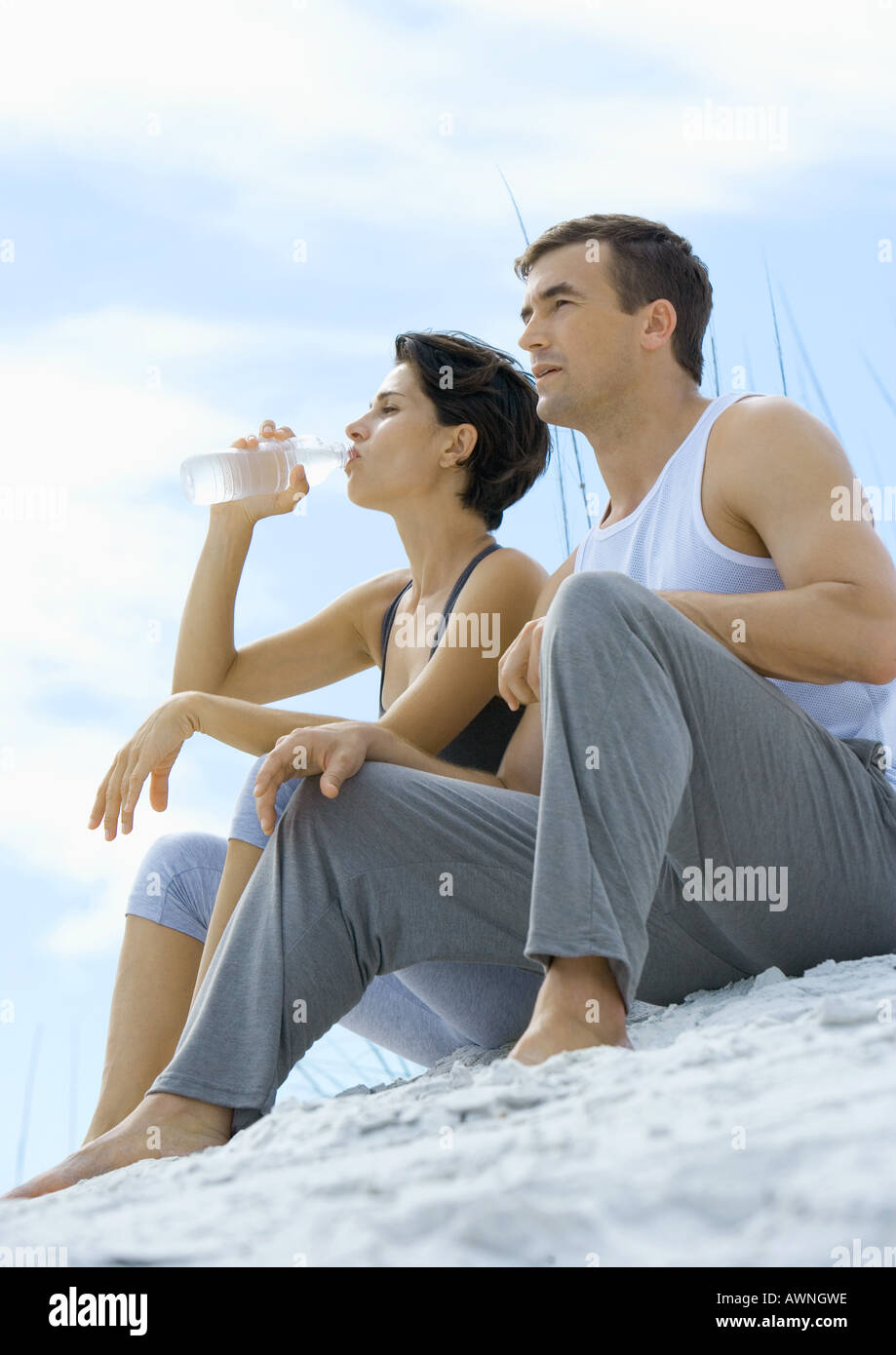 Couple in workout clothes sitting hi-res stock photography and images ...
