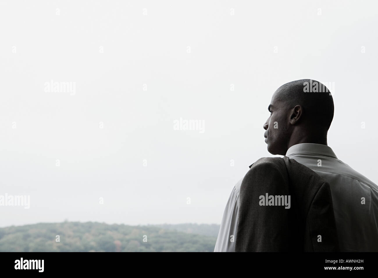 A businessman holding a jacket Stock Photo - Alamy