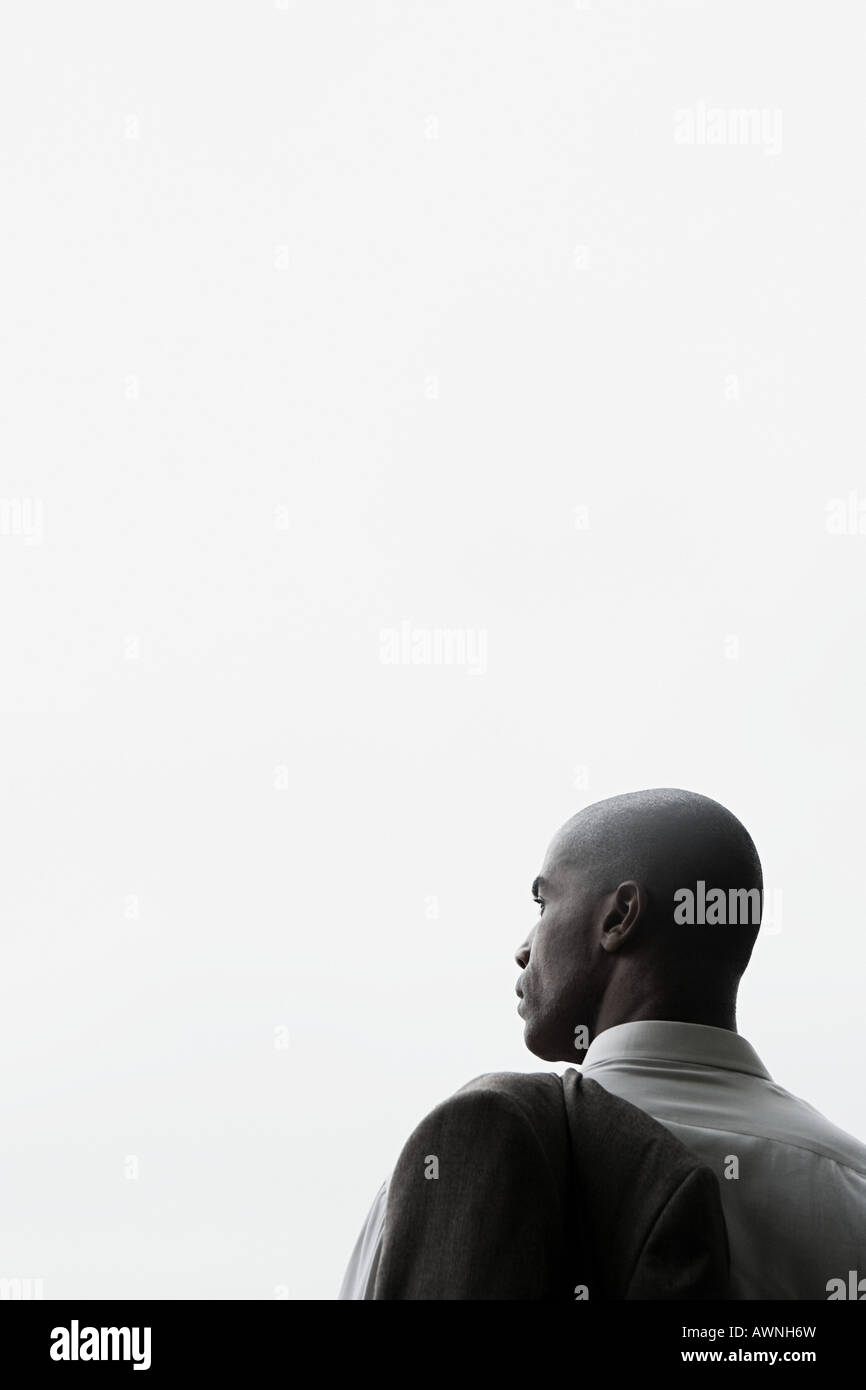 A businessman holding a jacket Stock Photo - Alamy