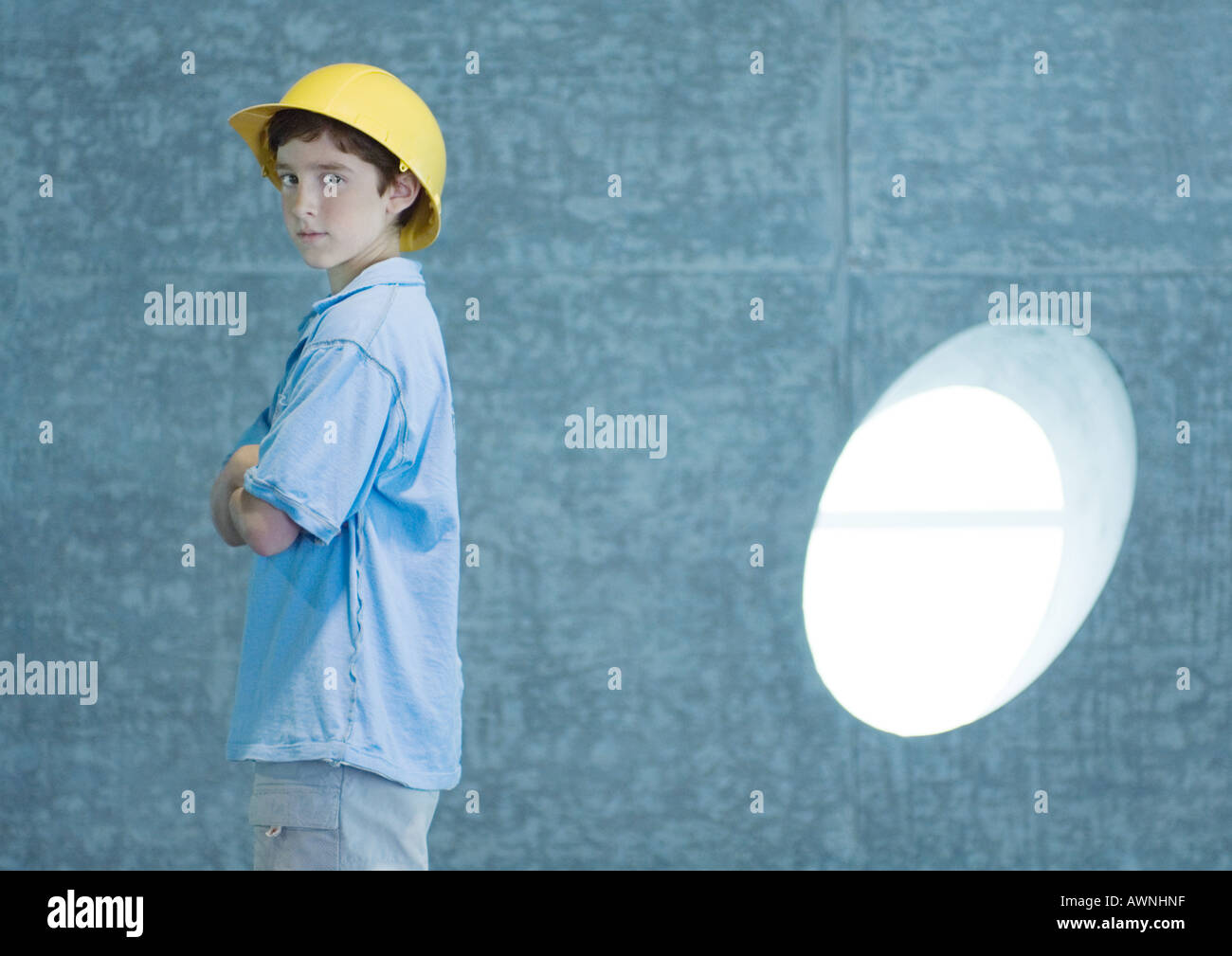 Boy wearing hard hat Stock Photo - Alamy