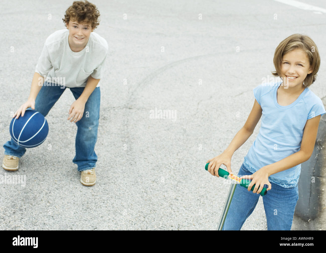 Suburban children playing in street Stock Photo - Alamy