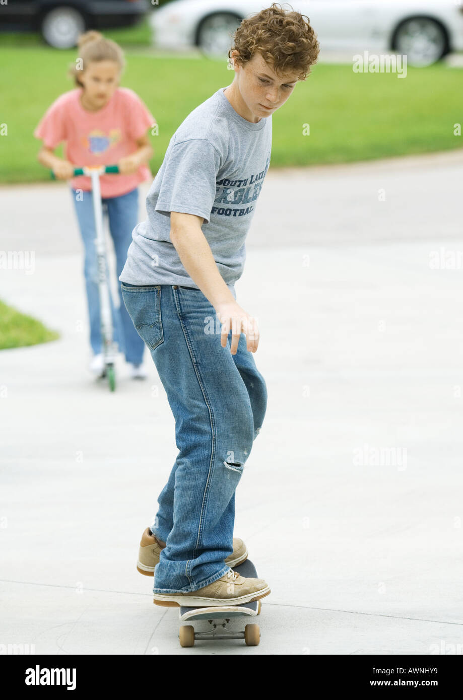 Suburban children playing in driveway Stock Photo - Alamy