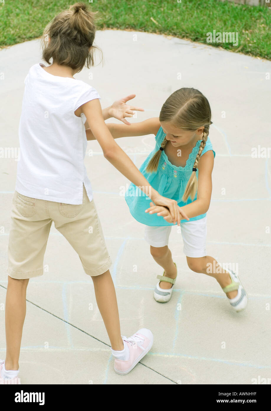 Girls playing hopscotch Stock Photo - Alamy