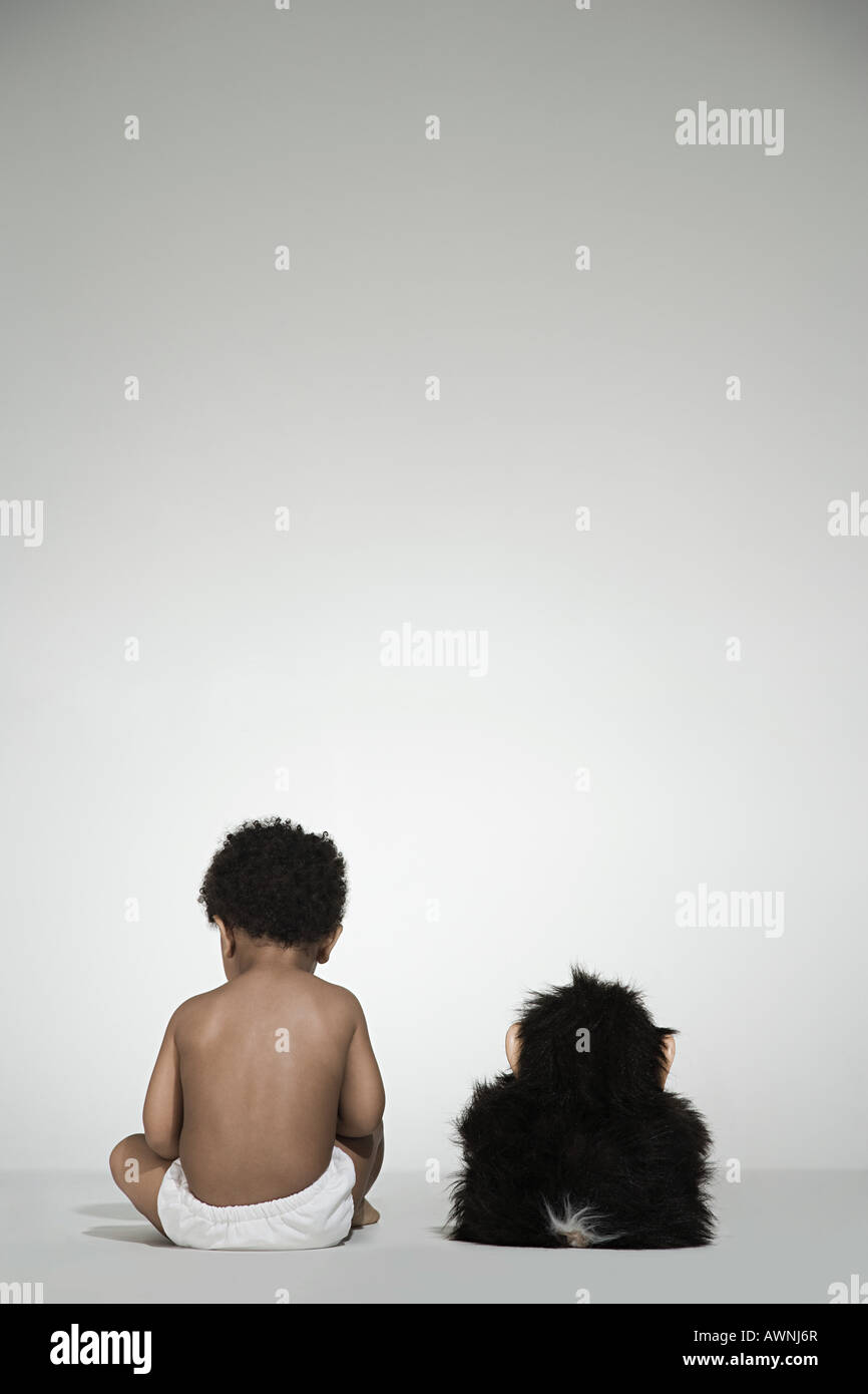 Boy and a toy monkey Stock Photo - Alamy