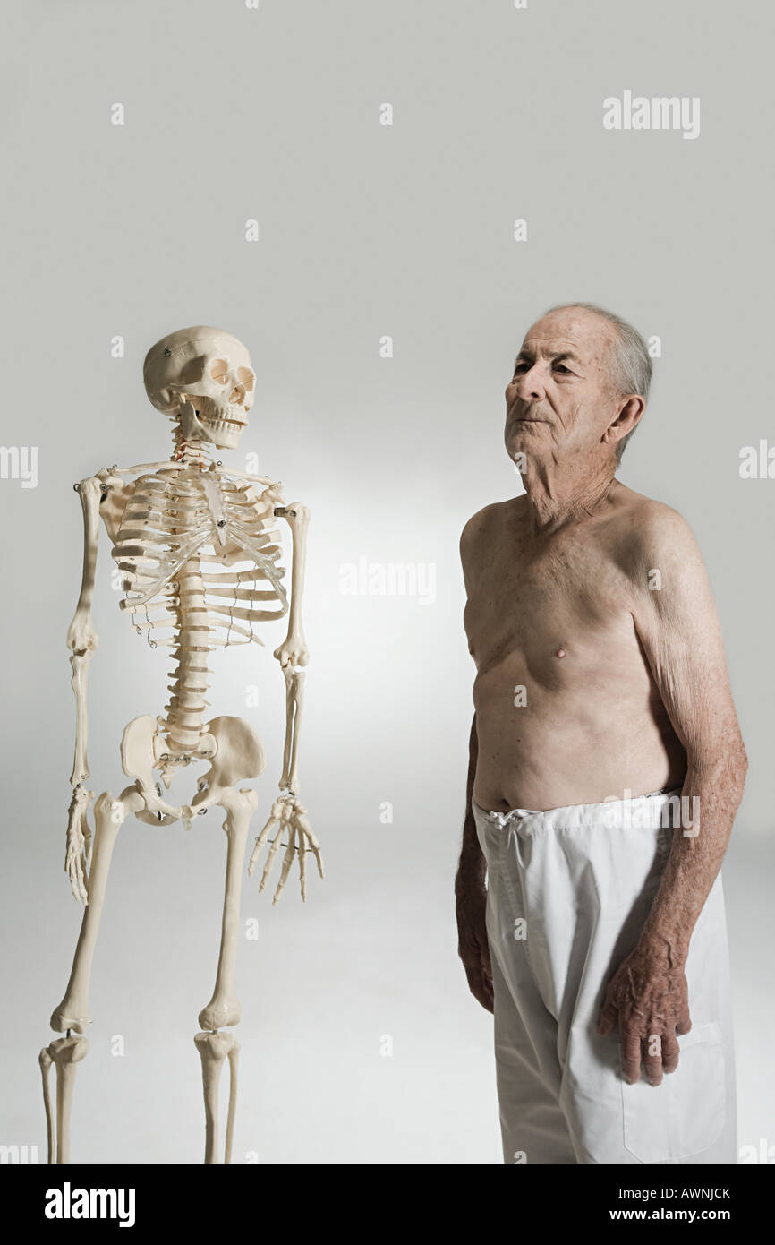 Senior man and a skeleton Stock Photo - Alamy