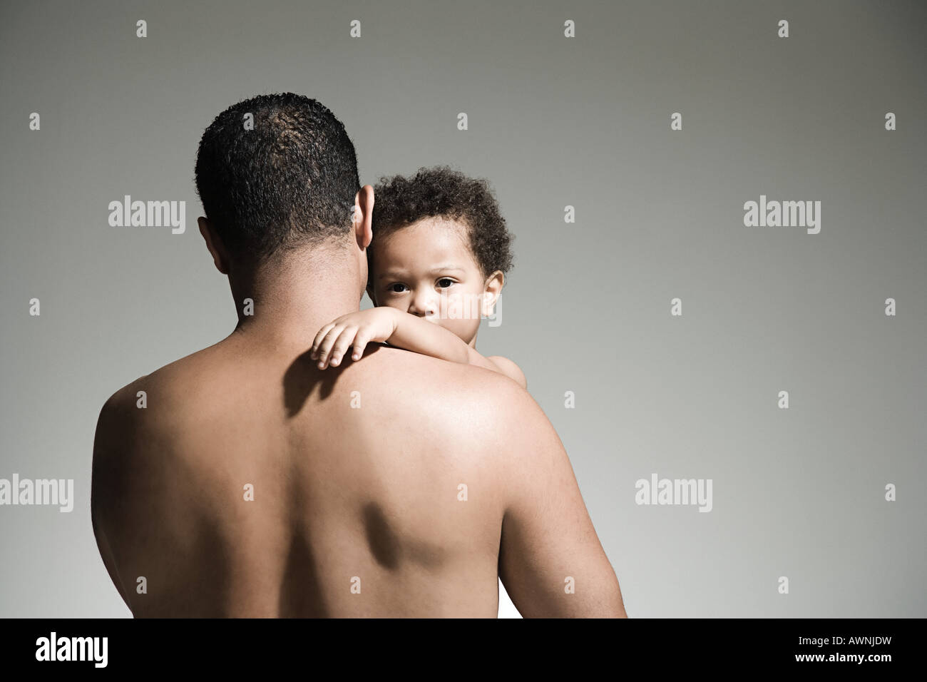 Father holding his son Stock Photo - Alamy