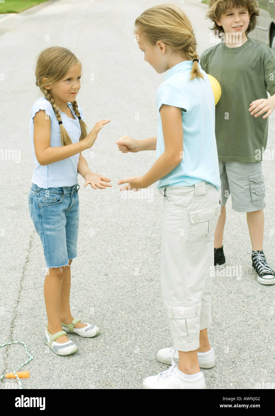 Suburban children playing in street Stock Photo - Alamy