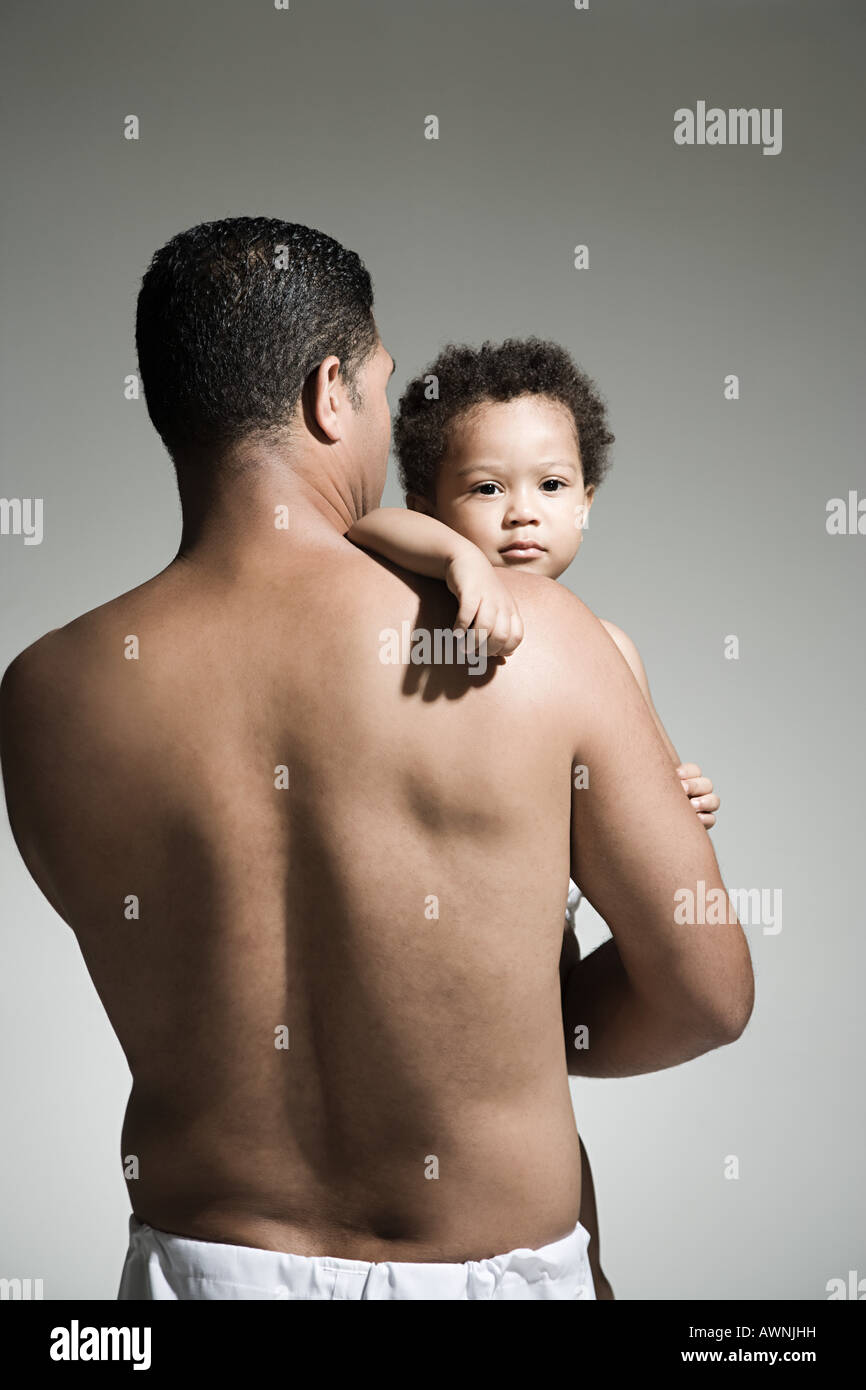 Father holding his son Stock Photo - Alamy
