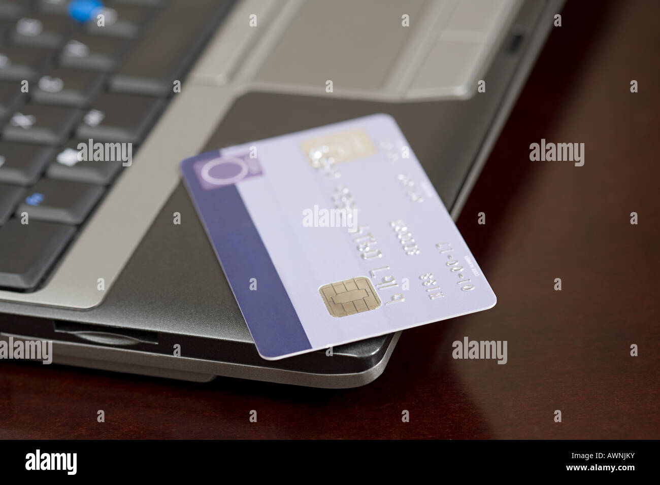 A laptop and a credit card Stock Photo - Alamy