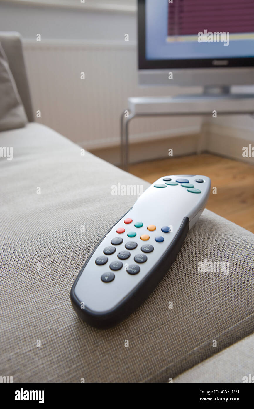 Remote control on a sofa Stock Photo - Alamy