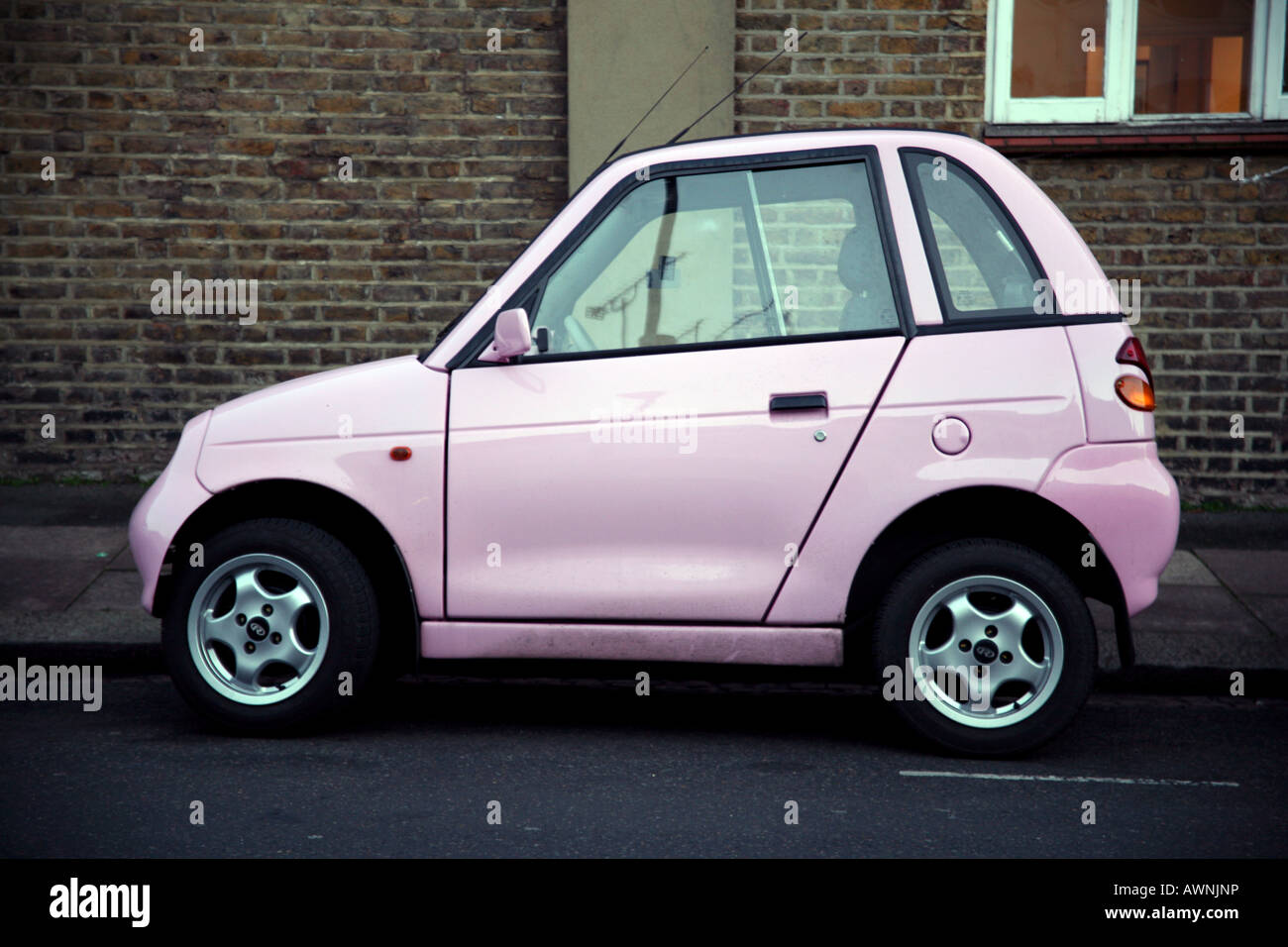 G-Wiz electric car parked on London street Stock Photo - Alamy