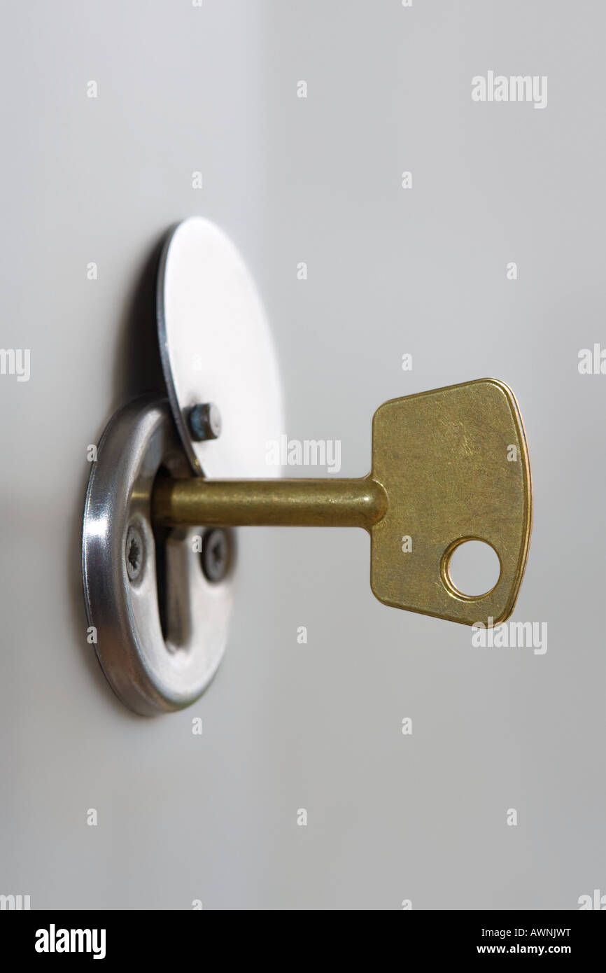 A key in a lock Stock Photo - Alamy