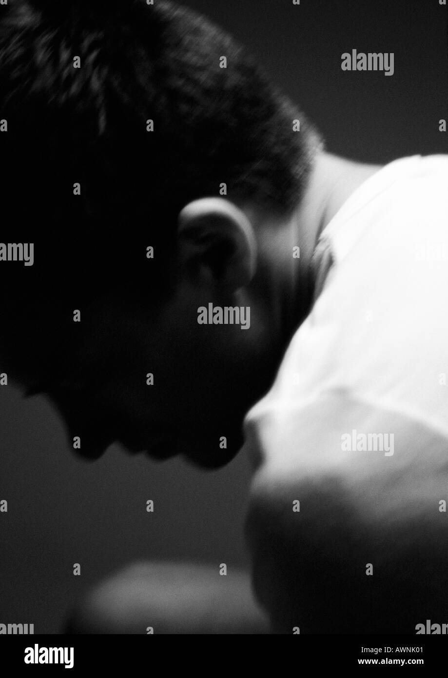 Man leaning head forward, blurred, close-up, black and white Stock ...