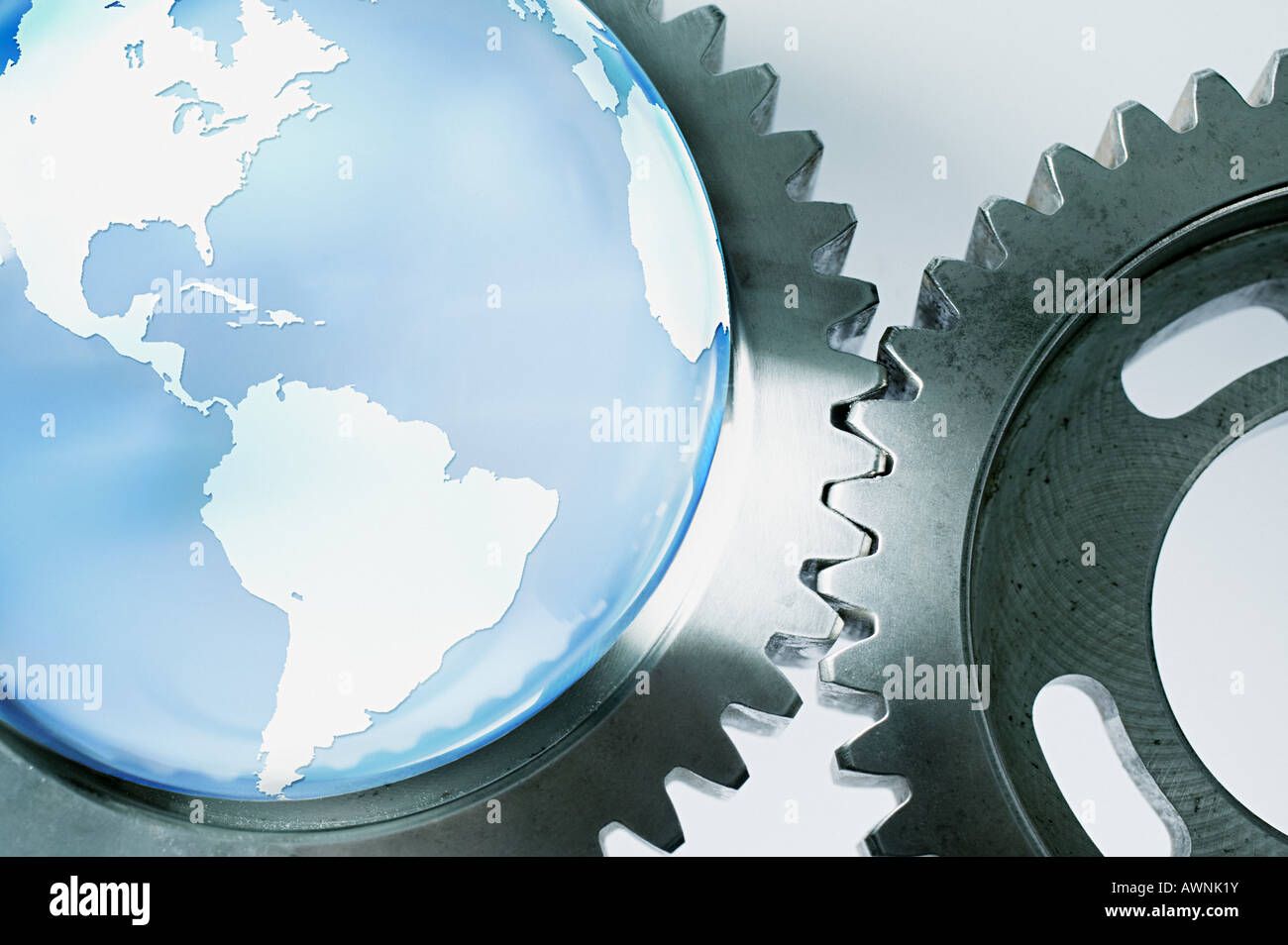Planet earth and machine cogs Stock Photo - Alamy