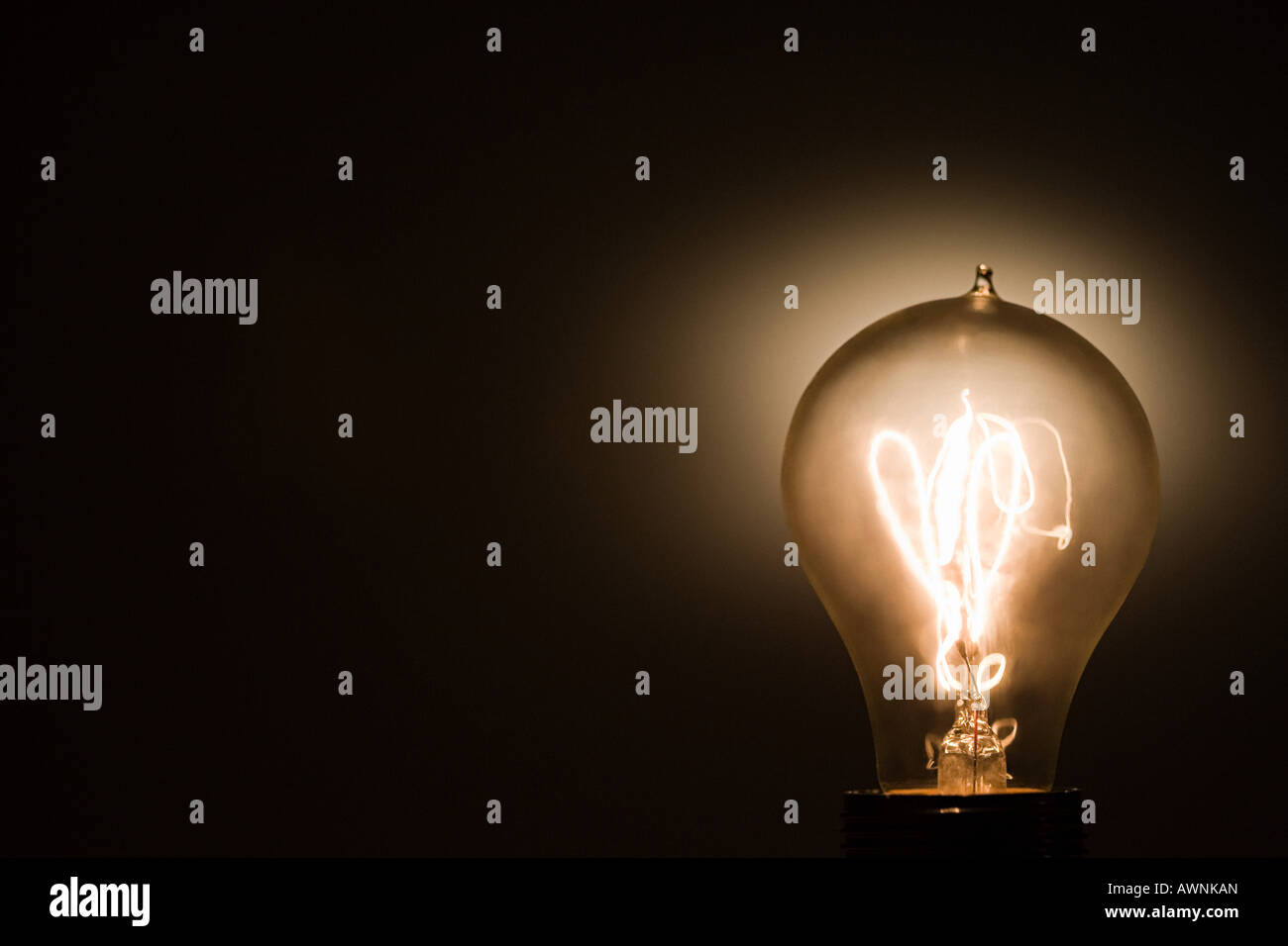 An illuminated lightbulb Stock Photo - Alamy