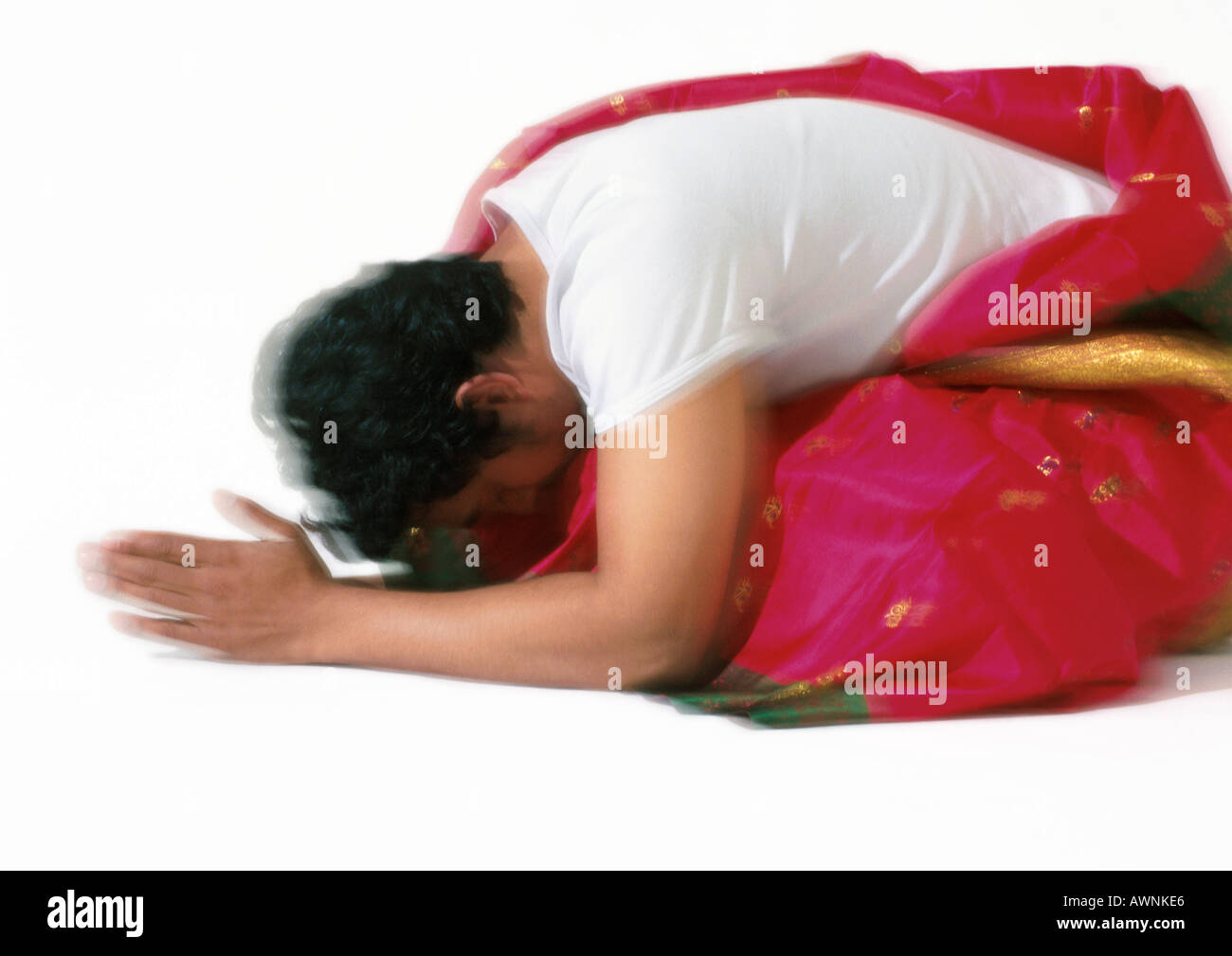 Hindu man bowing and praying, blurry Stock Photo - Alamy