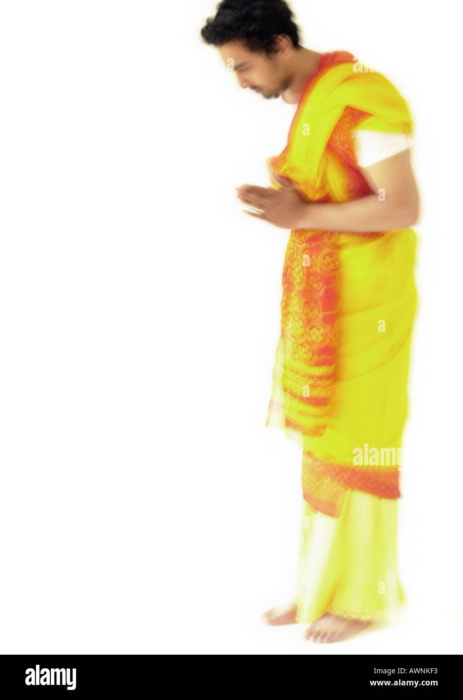 Hindu man bowing and praying, blurry Stock Photo - Alamy