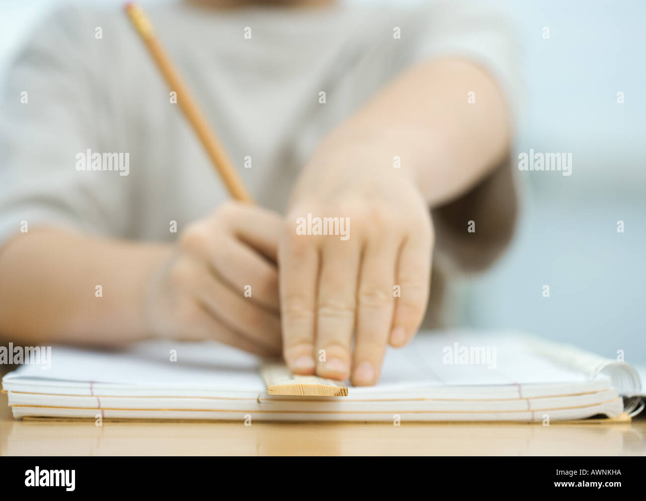 Child tracing ruler in notebook Stock Photo - Alamy