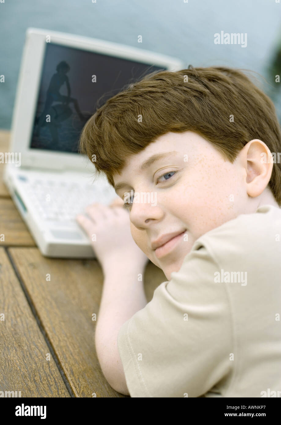 Child using laptop over shoulder hi-res stock photography and images ...