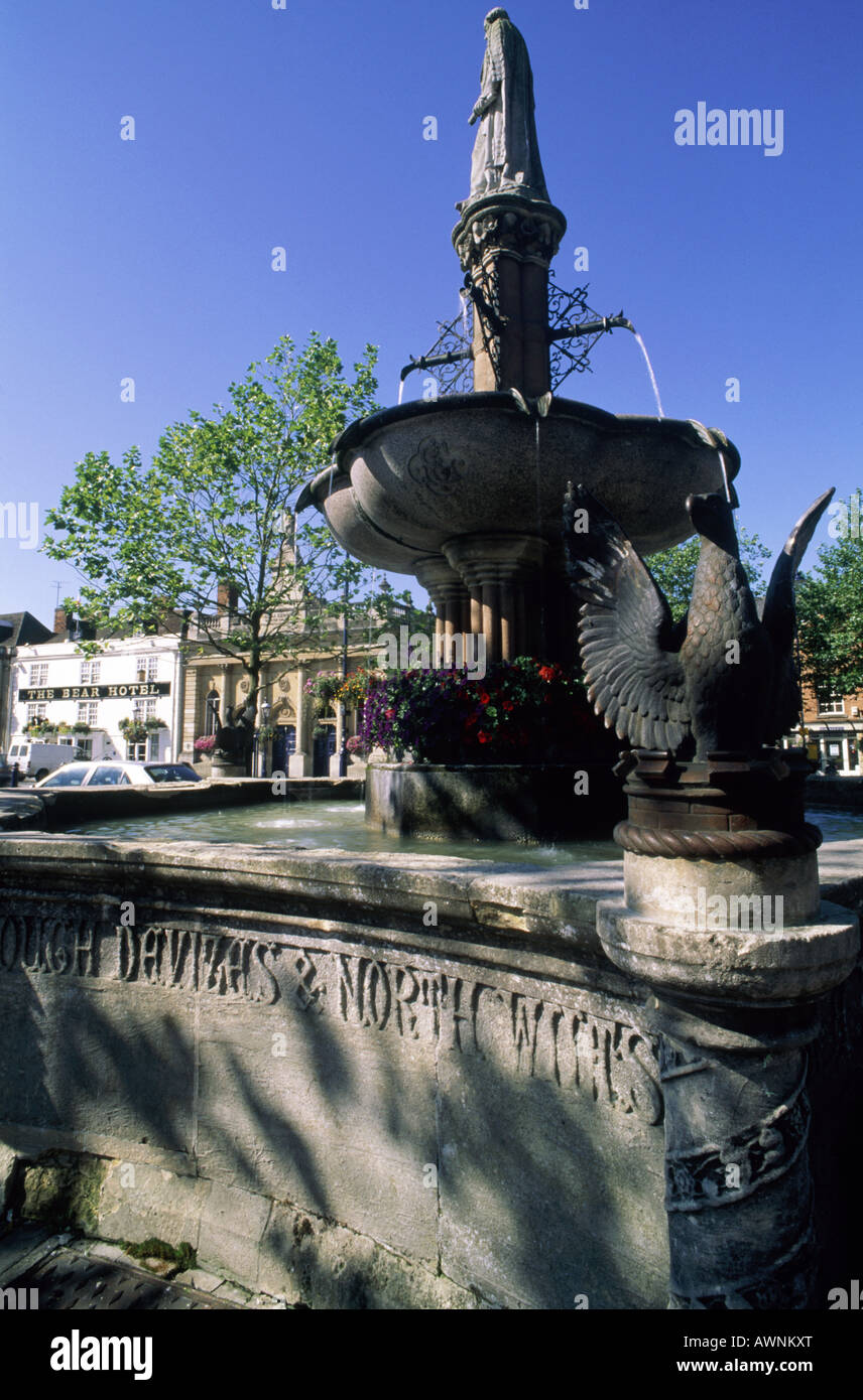 Town centre. Market square. Fountain. Water spouts. Statue. Flowers ...