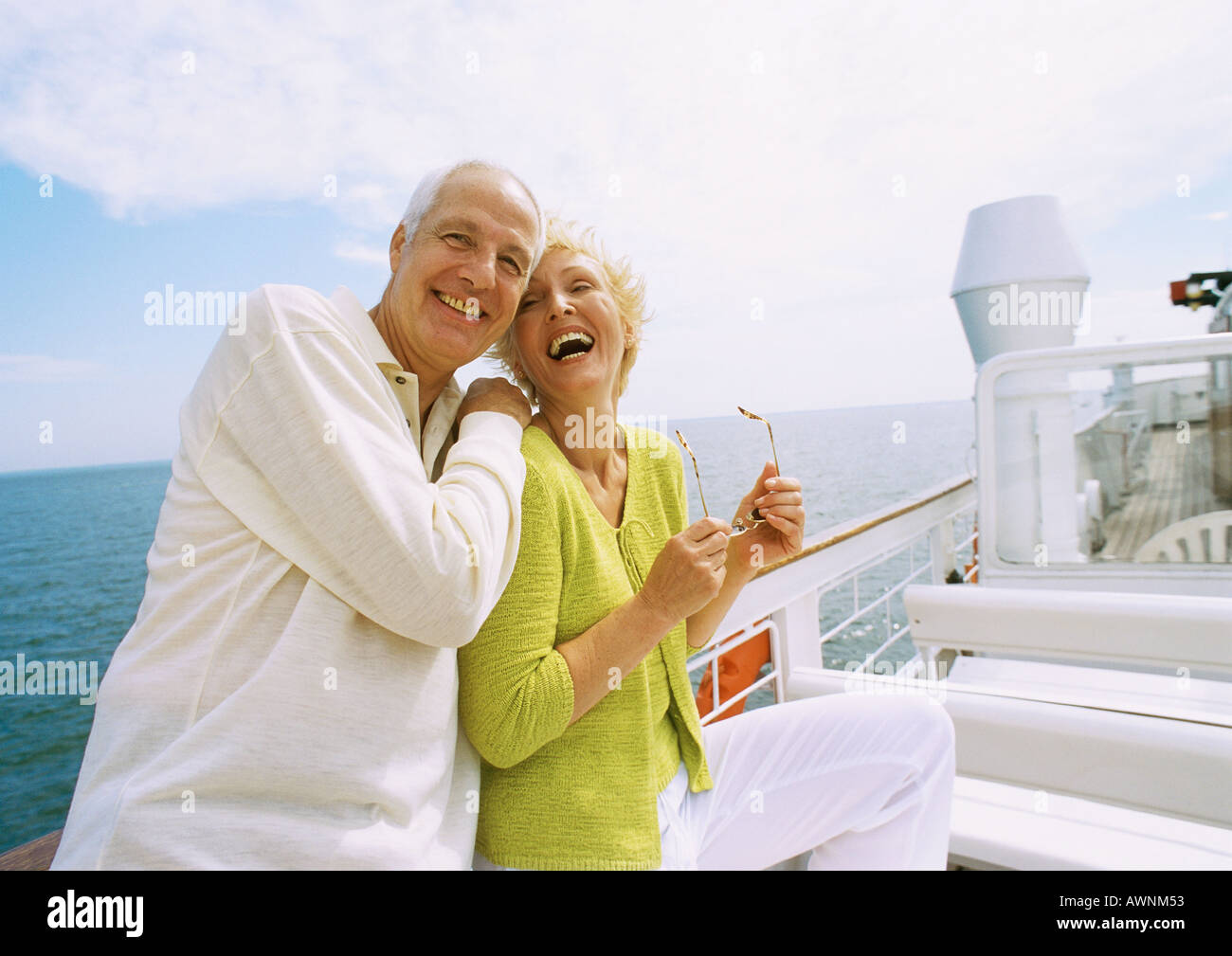 Mature couple posing on boat deck, laughing Stock Photo - Alamy