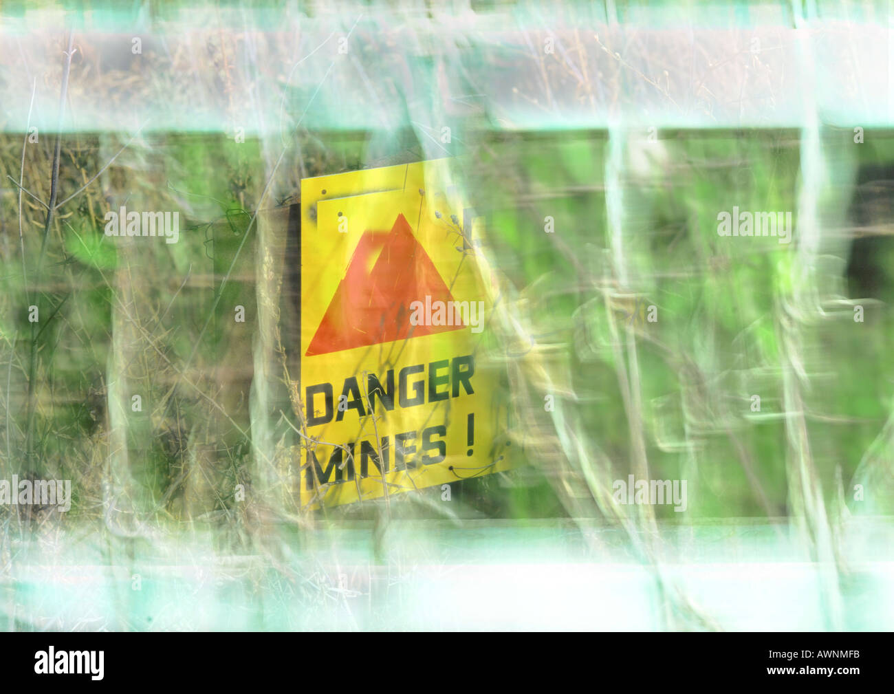 Danger mines! sign, montage Stock Photo - Alamy