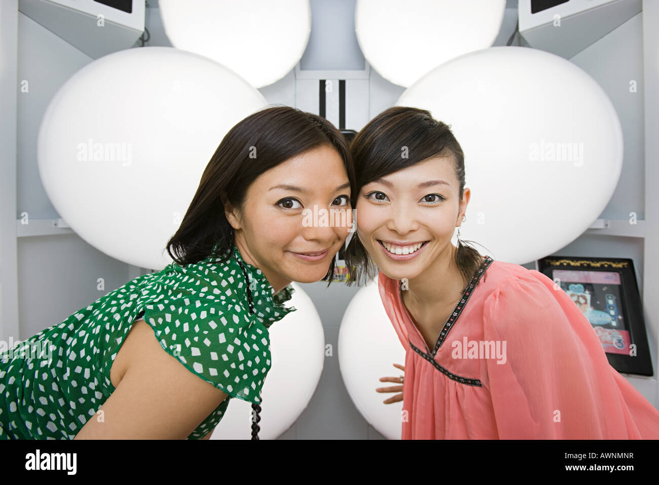Friends in a photo booth Stock Photo - Alamy