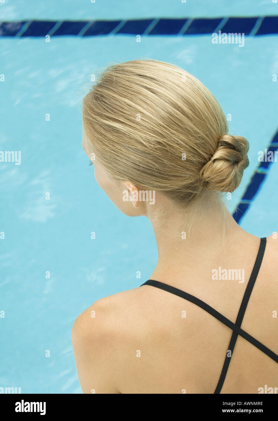 Woman facing pool, rear view Stock Photo - Alamy