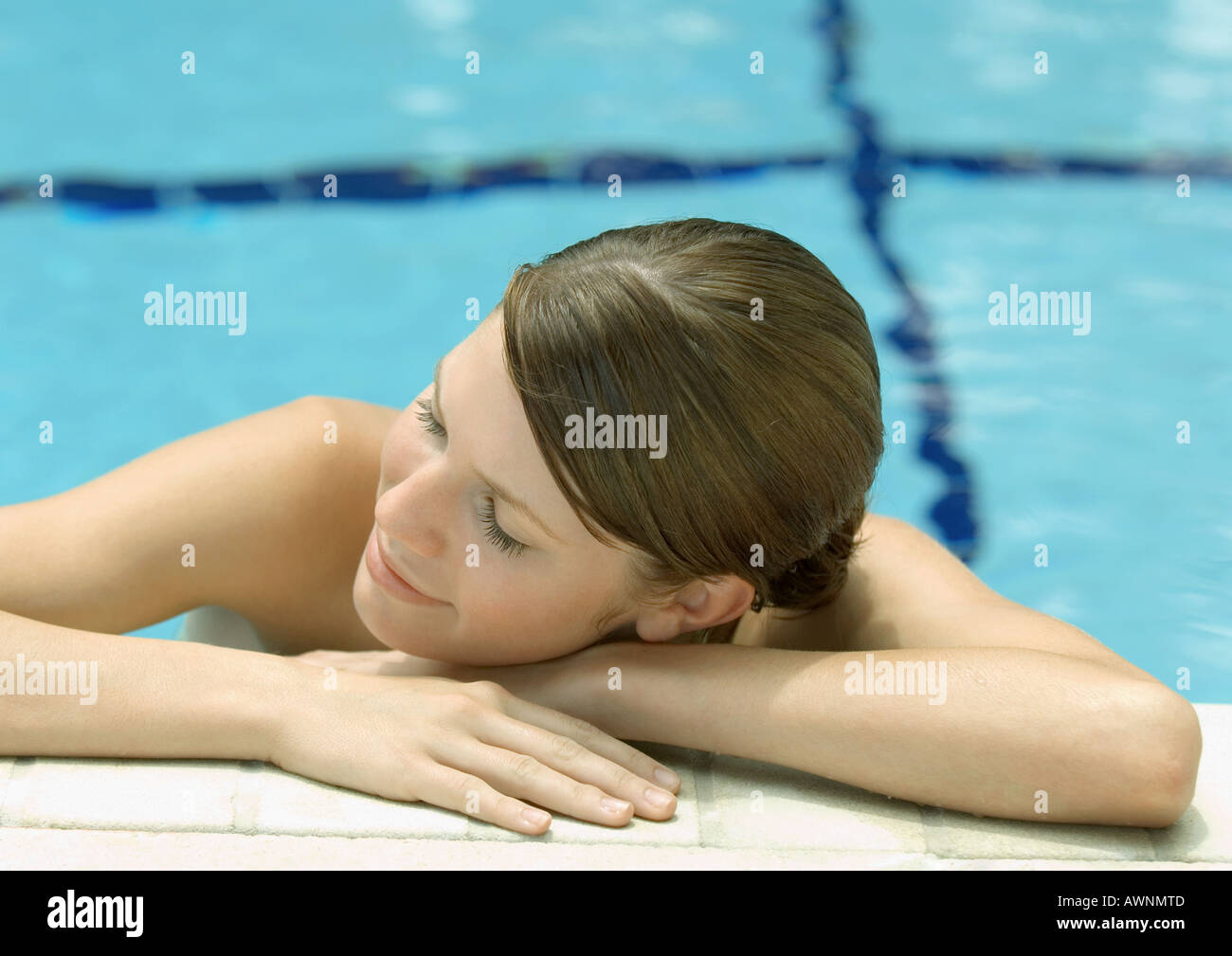 Woman leaning head on folded arms hi-res stock photography and images ...