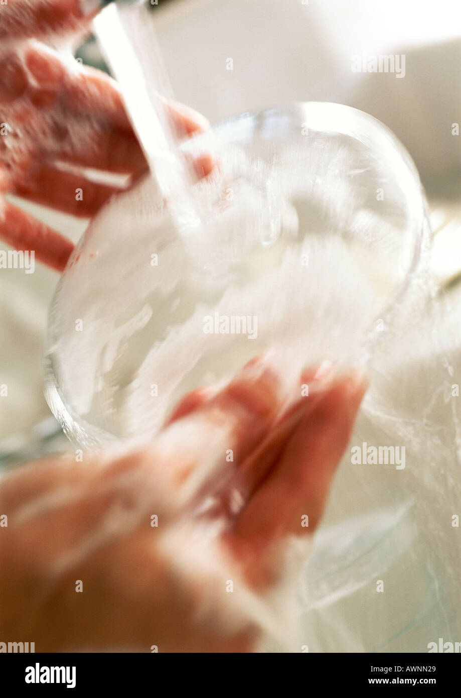 Hands washing dish, close-up Stock Photo - Alamy