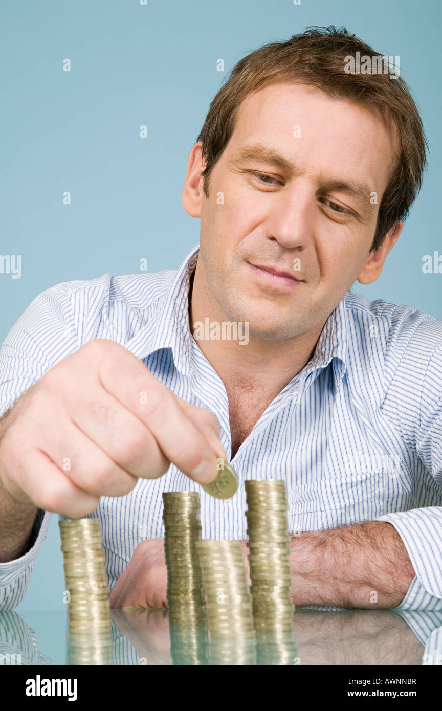 Man counting stacks of money hi-res stock photography and images - Alamy
