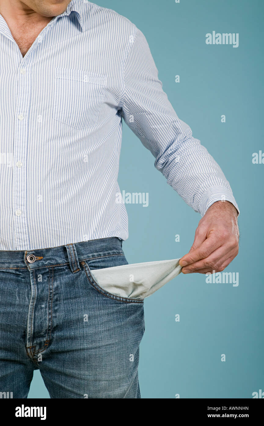 Man with empty pocket Stock Photo - Alamy