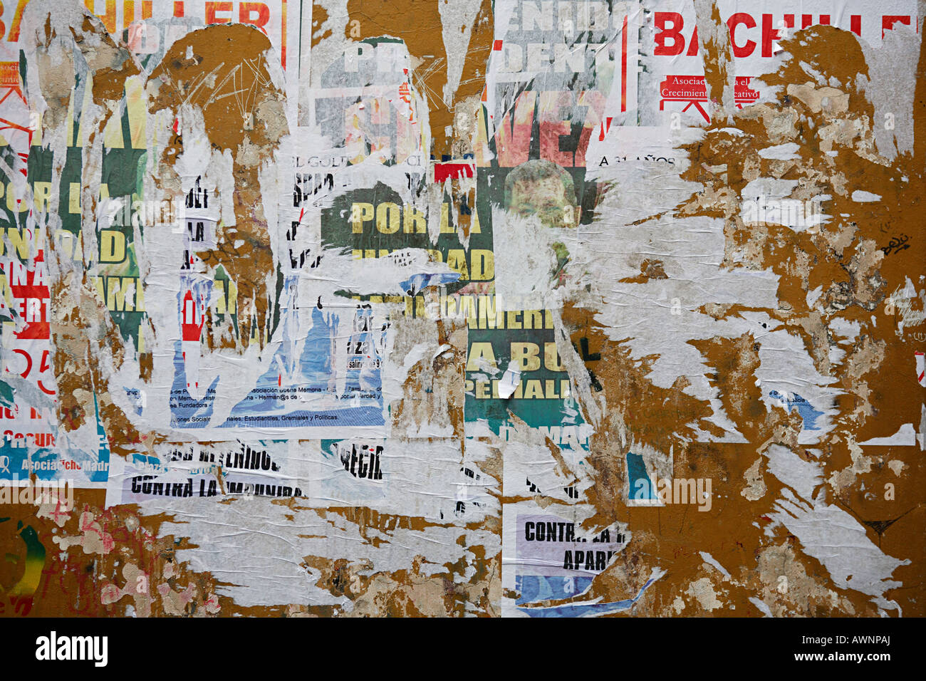 Torn posters on wall Stock Photo - Alamy