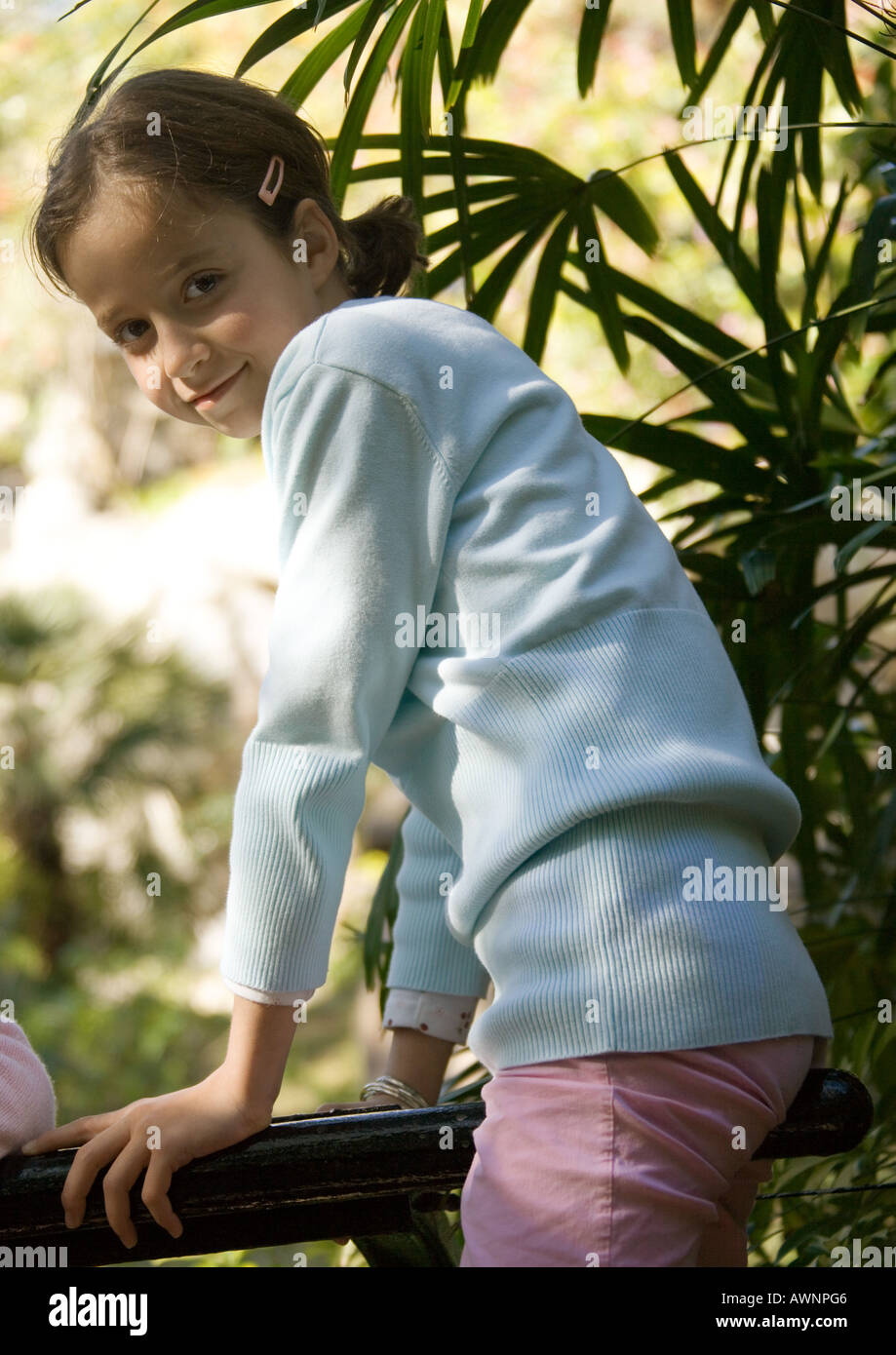 Child leaning over railing hi-res stock photography and images - Alamy