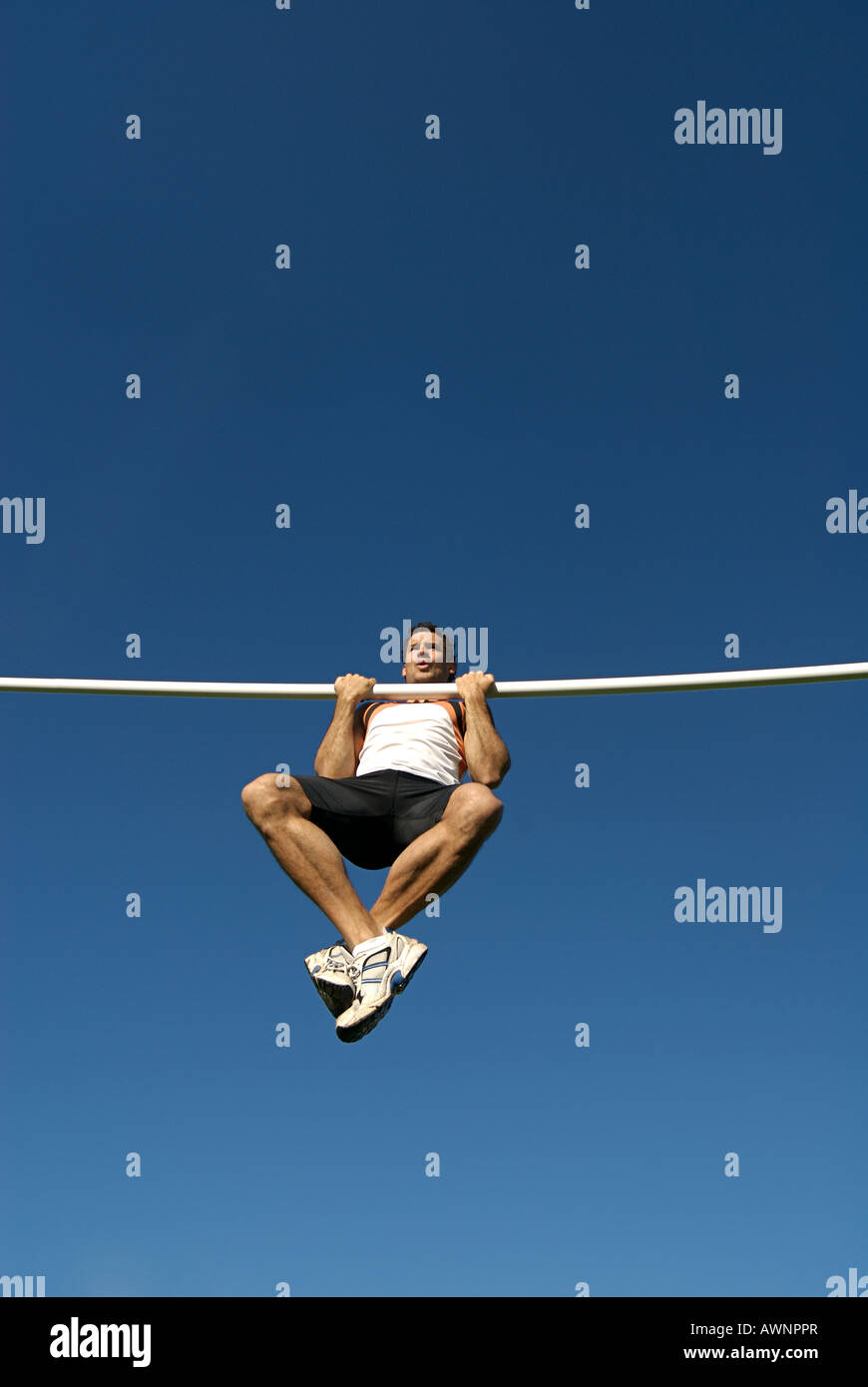 A man doing chin ups Stock Photo - Alamy